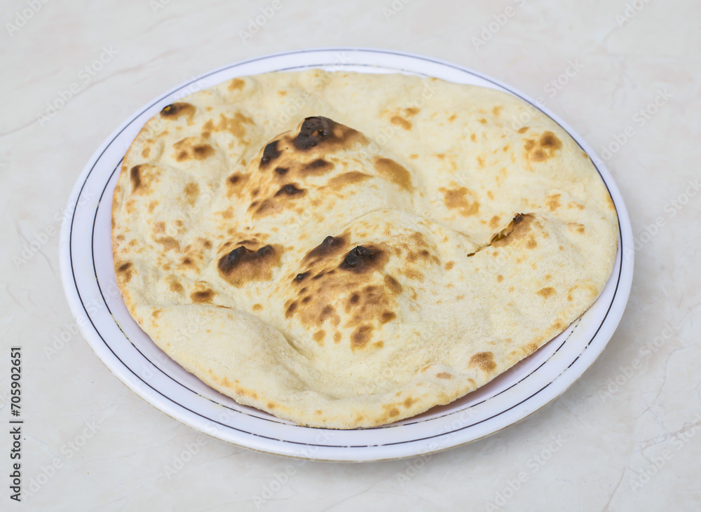 Tandoori Roti served in plate isolated on grey background side view of ...