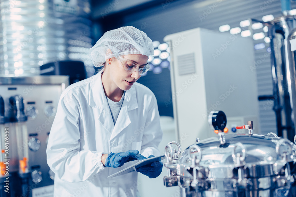 staff work in science medical lab factory check record pressure tank ...