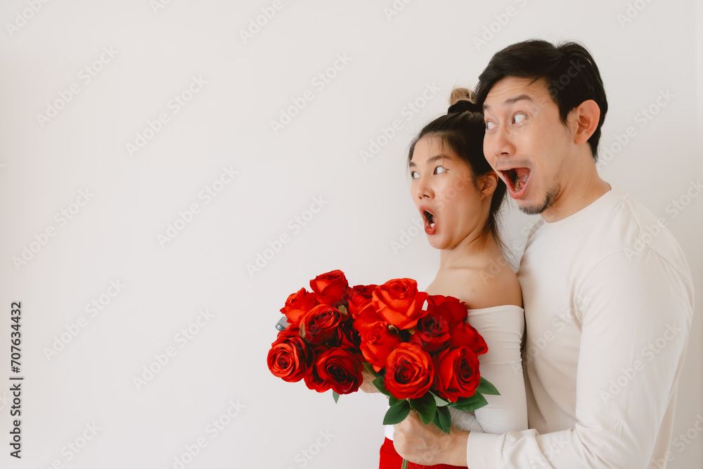 Funny wow shocked face of asian Thai couple holding red roses on ...