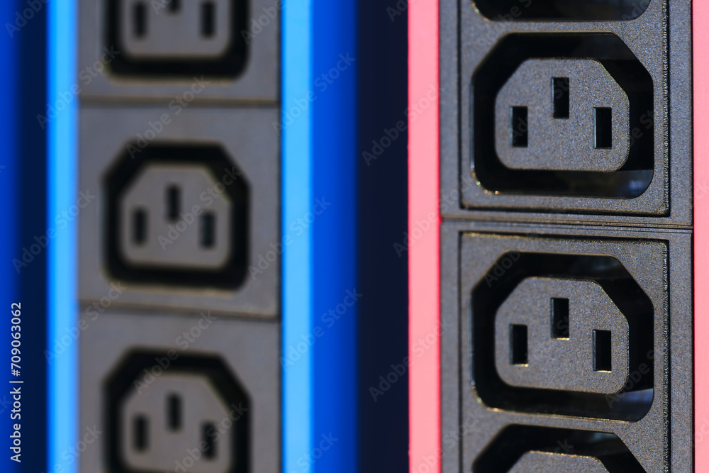 Electricity sockets IEC 60320 C13 in the server rack. Electicity ...