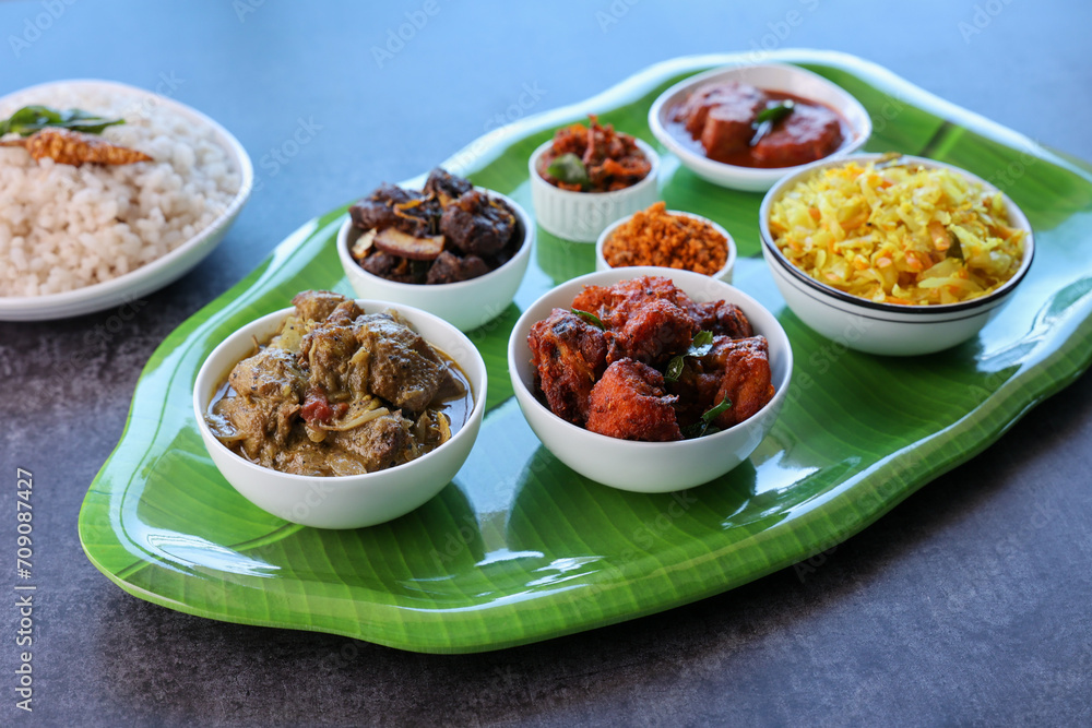 Kerala special food sadhya in banana leaf plate with Chicken fry Duck ...