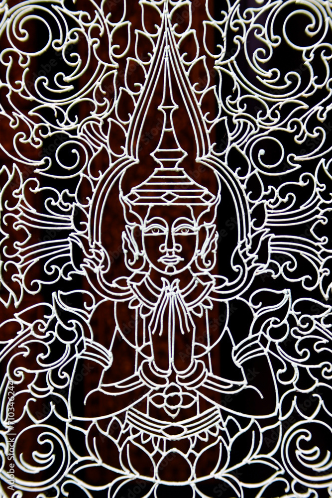 Royal palace complex. Metal mesh gate with a representation of Buddha ...