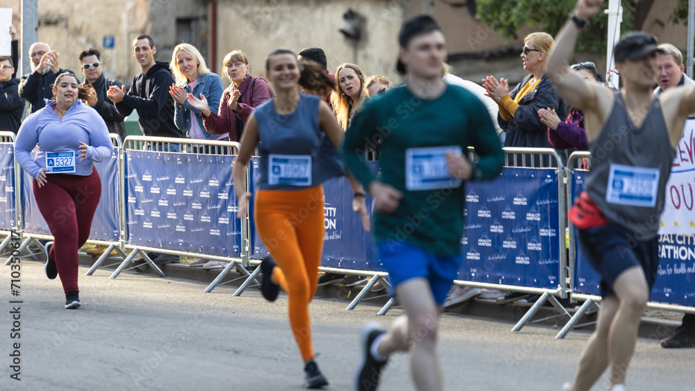 Diverse Group of People Running a Marathon in a City During the Day ...