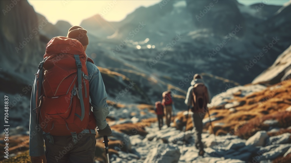 Hikers trekking and walking through a beautiful mountain range showing ...