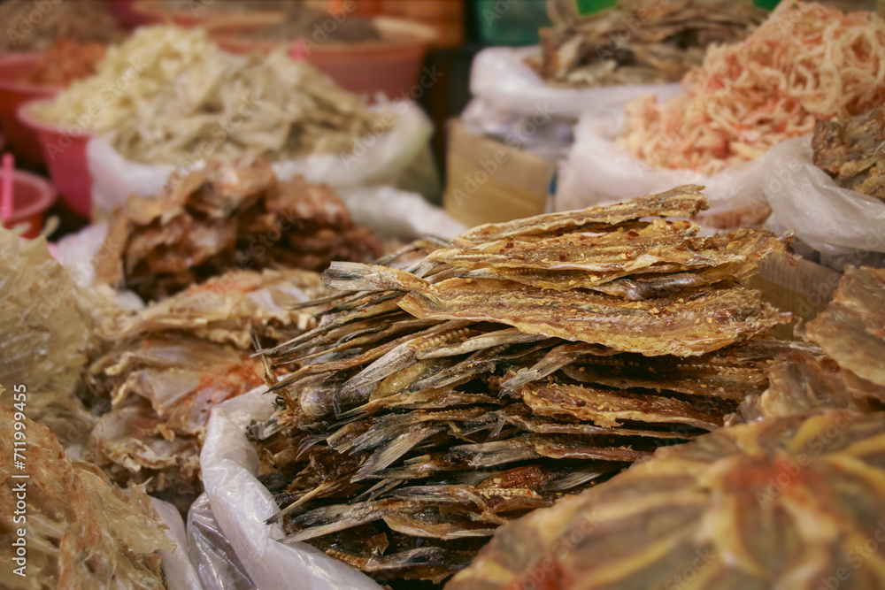 Assorted dried seafood displayed at the traditional local market ...