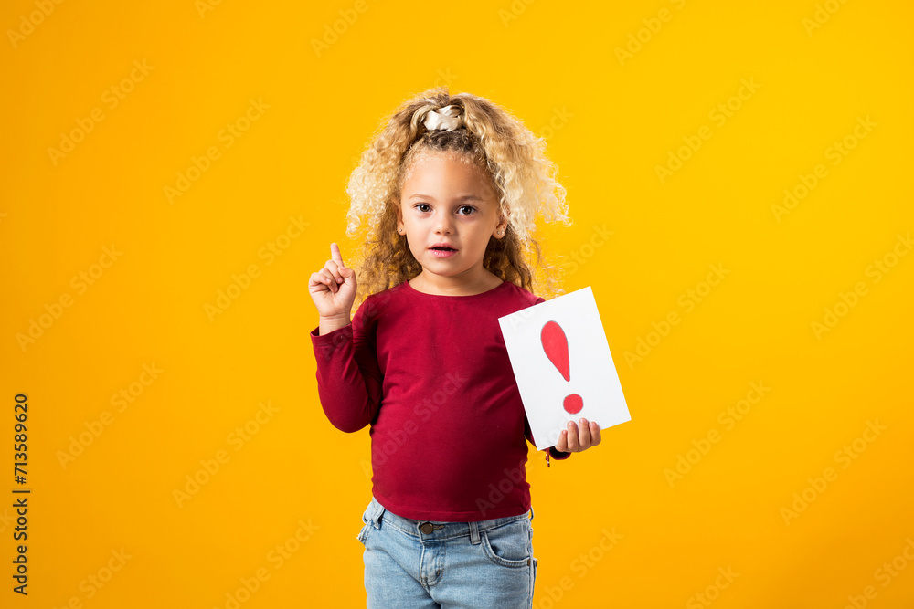 Enchanting Exploration. A Portrait of a Thoughtful child Girl Holding ...