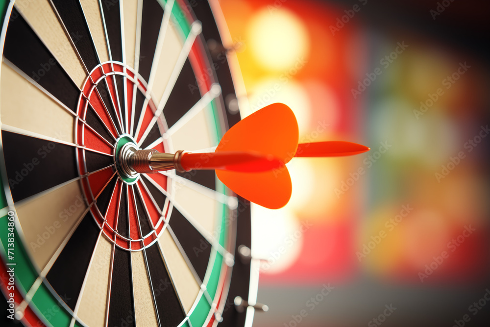 Photo Stock dart is embedded in the center of a dartboard. The ...