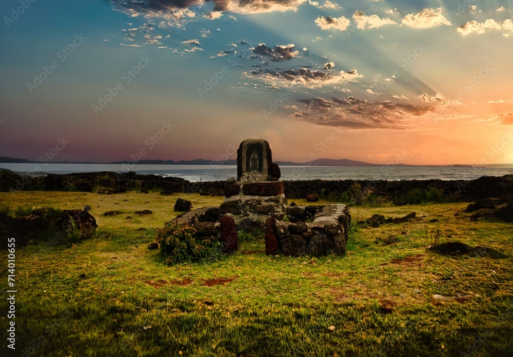 A shrine for virgin Mary by the Pacific Ocean in Rapa Nui. The Religion ...