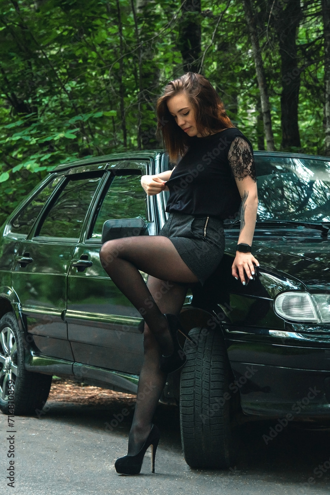 beautiful girl in short shorts near the car. sexy girl in shorts and ...
