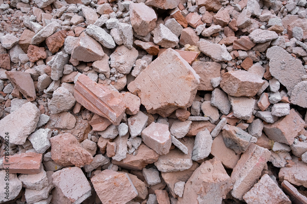 Shattered, broken wall bricks, construction waste after building ...