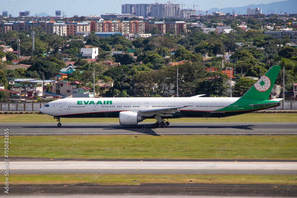 Aerial view of an EVA Air Boeing 777-300ER on runway at Ninoy Aquino ...