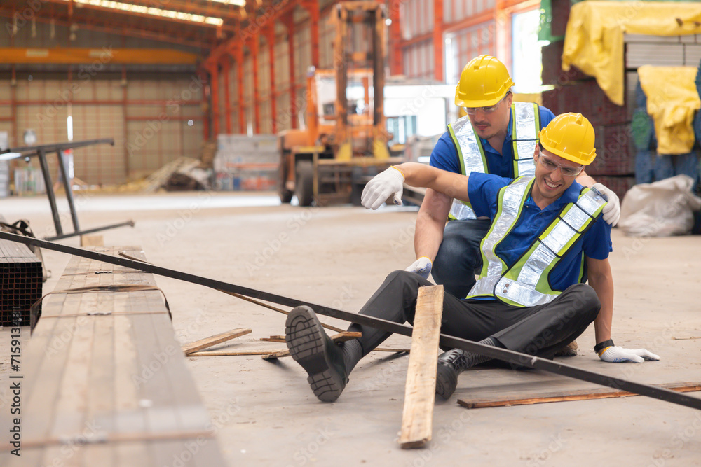 Male worker got help from his co-worker after got an accident inside of ...