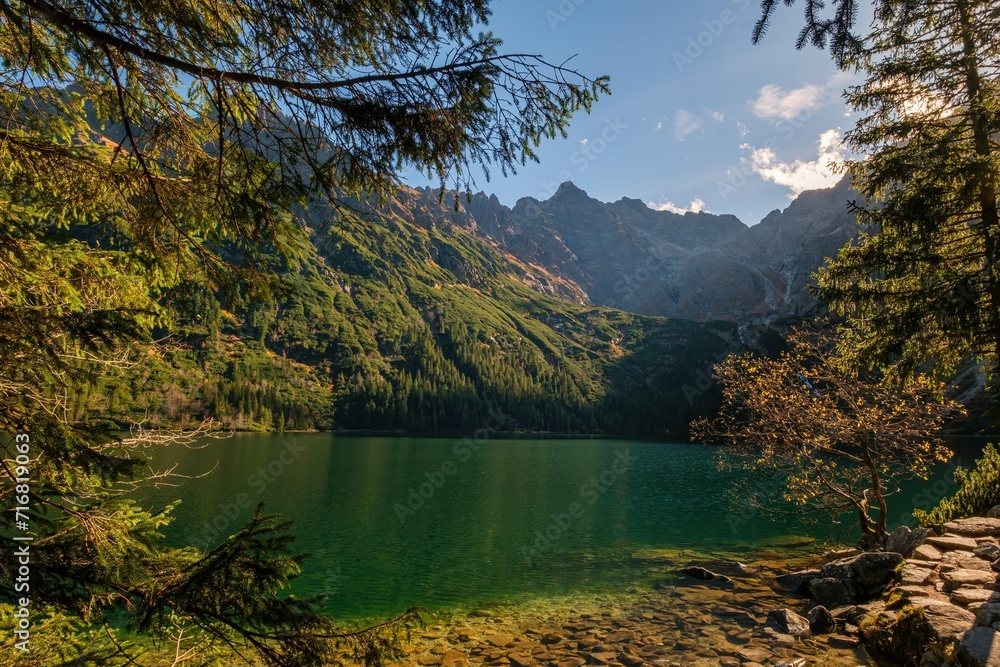 Beautiful, colorful mountain lake with an azure surface and mountain ...