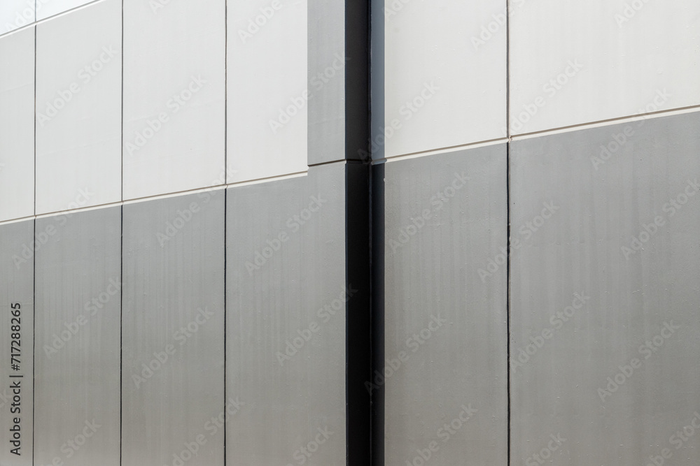 The exterior wall of a contemporary commercial style building with two ...
