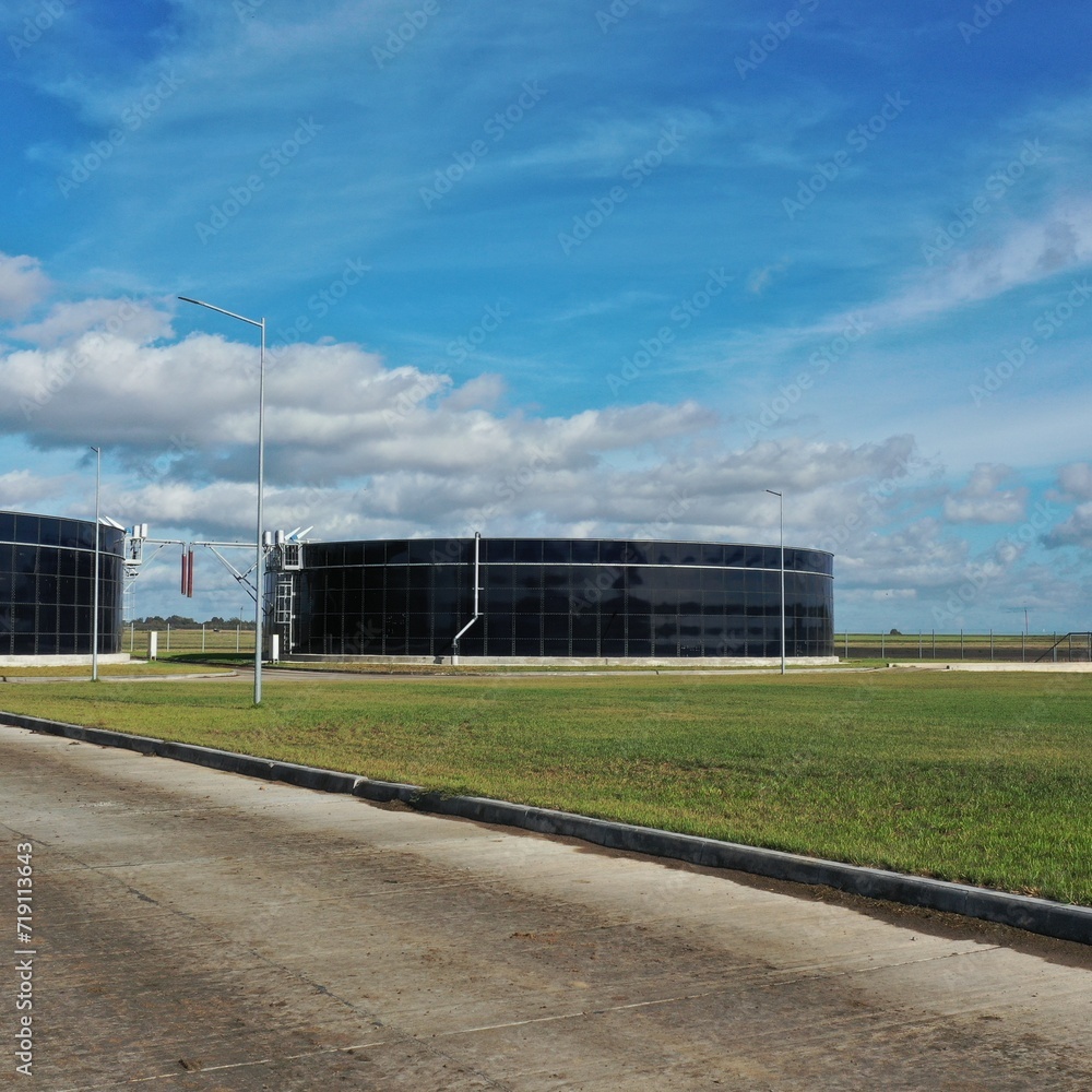 Huge round metal cistern with open top for outdoor storage of manure ...