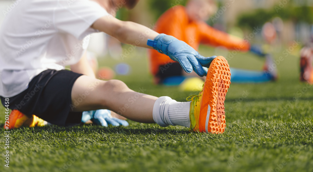Young Boy Doing Soccer Stretching Exercises. Kids in Football ...
