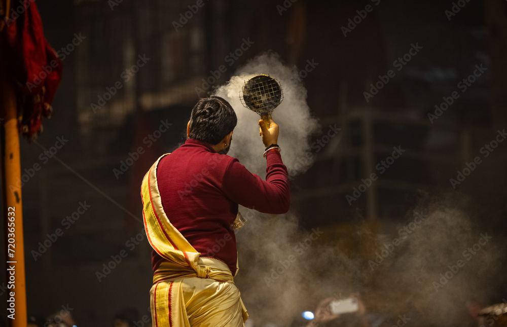 Ganga aarti, Portrait of young priest performing holy river ganges ...