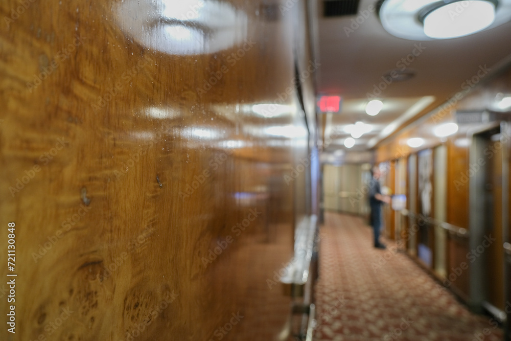 Wooden paneled cabin corridor hallway aisle to staterooms and suites ...