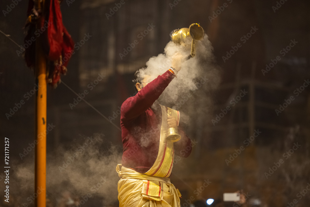 Ganga aarti, Portrait of young priest performing holy river ganges ...