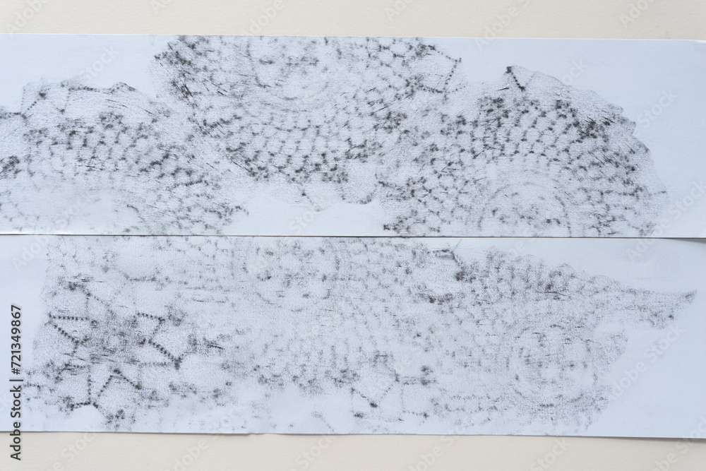 paper background featuring rubbing pattern (crochet table cloth) Stock ...