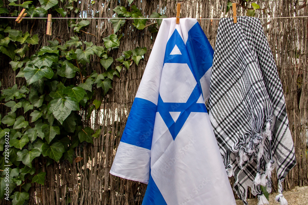 Israel flag and Palestinian scarf together lying on a rope to dry after ...