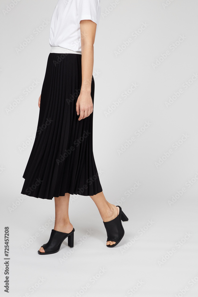 Black women's luxury Classic Long Maxi pleated skirt on model isolated ...