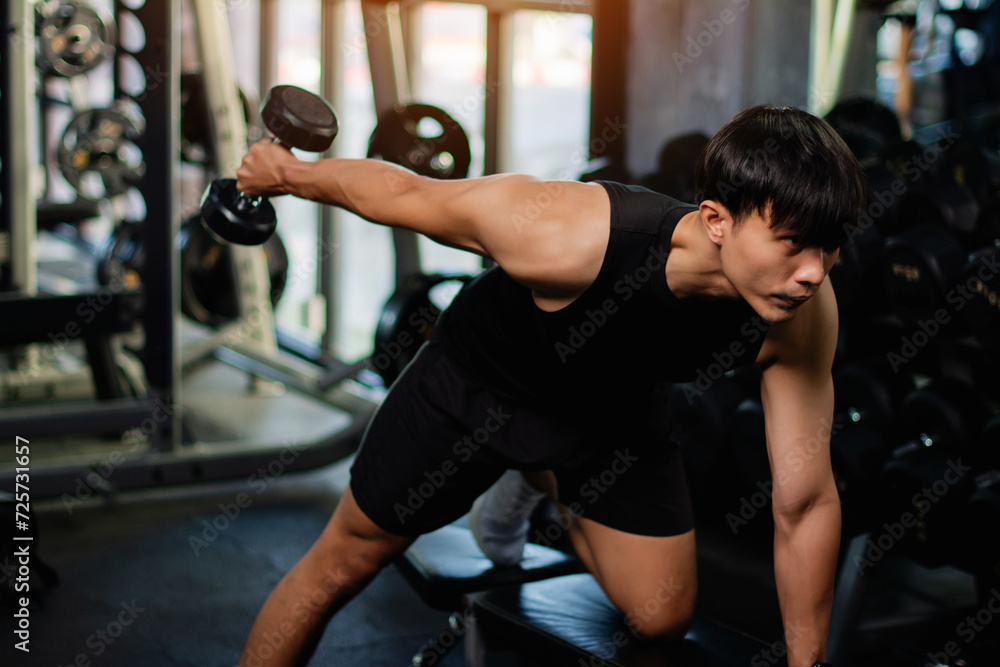 Lifting dumbbell exercises builds strong upper arm muscles. Exercise ...