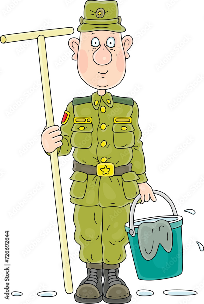 Funny young orderly soldier on sentry duty with a mop, a bucket and a ...