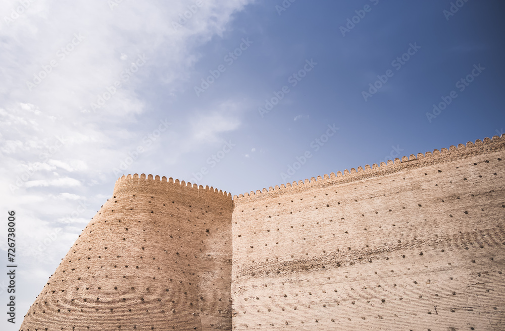 Ark Citadel with brick fortress walls in the ancient city of Bukhara in ...