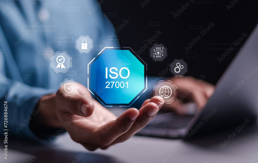 Fotografie ISO 27001 concept. Businessman use laptop with virtual ISO ...
