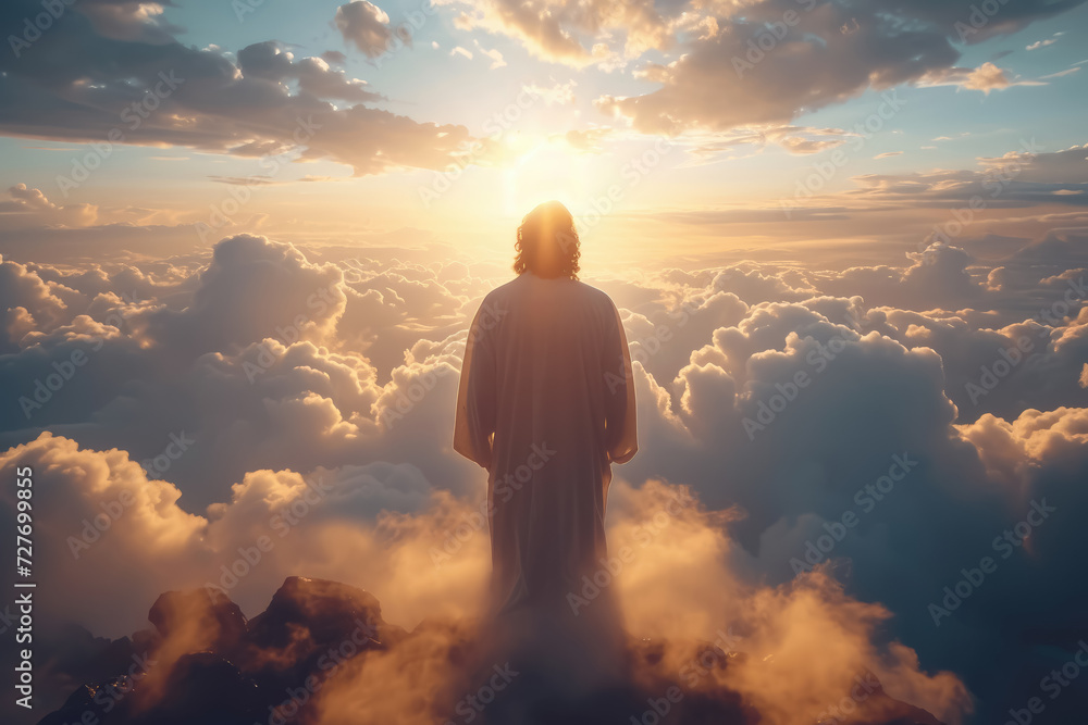 Back view of Jesus christ ascending to heaven above the bright light ...