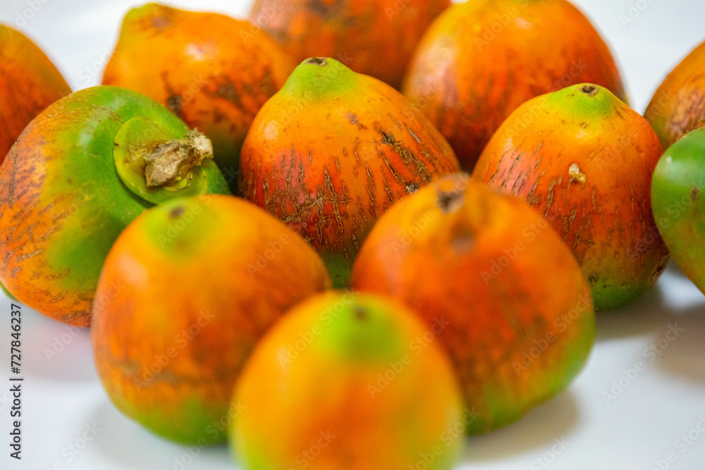 Rare and exotic fruit of the peach palm (Bactris gasipaes), typical ...