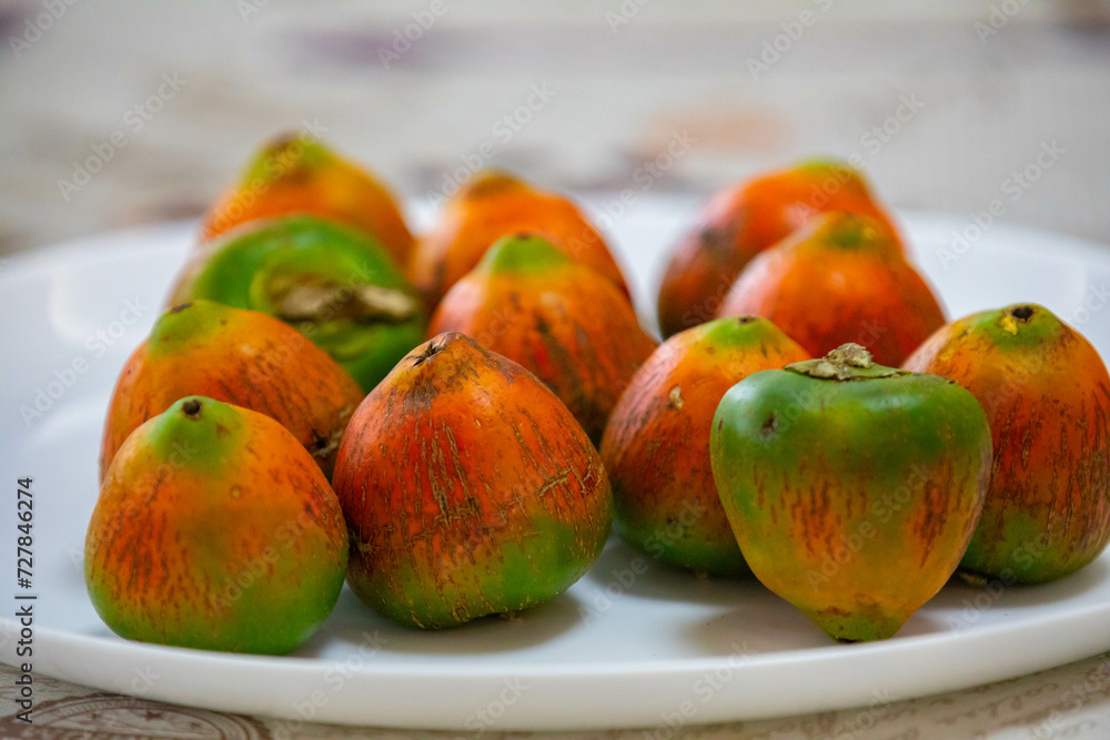Rare and exotic fruit of the peach palm (Bactris gasipaes), typical ...
