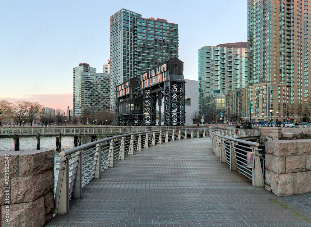 Walkway with Long Island City sign on transfer bridges, support ...