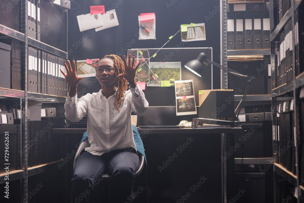 Law enforcement investigator using ar technology to analyze crime scene ...