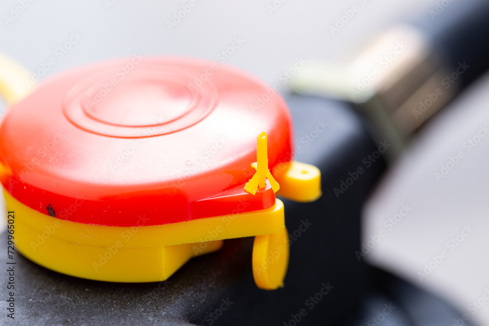closeup of a palm button of a reusable and refillable foam fire ...