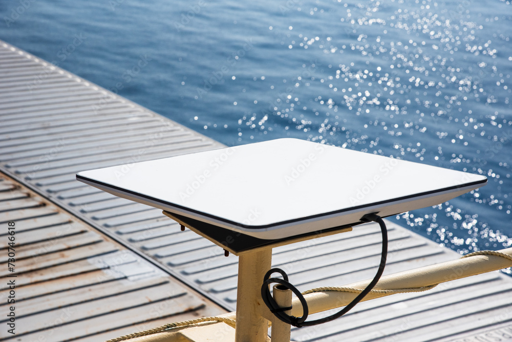 SpaceX Starlink satellite dish mounted on board of big container ship ...