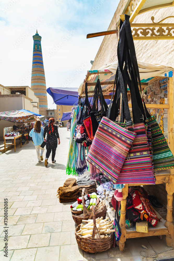 Souvenirs at the street market in front of Islam Khoja Madrasa ...
