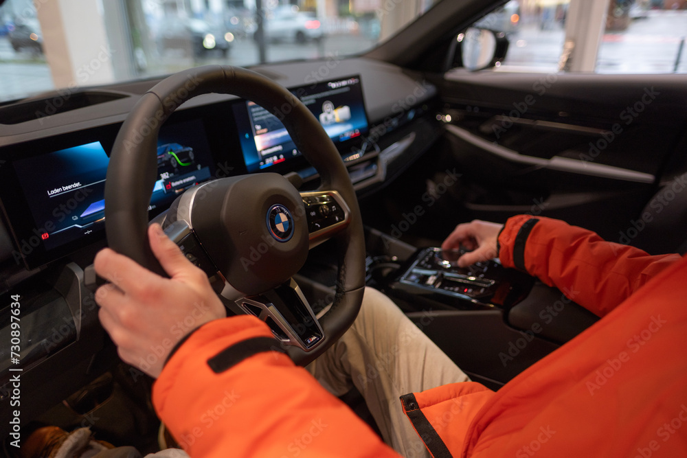 man in car driving BMW i5 eDrive40, digital panel, Interior, cockpit ...