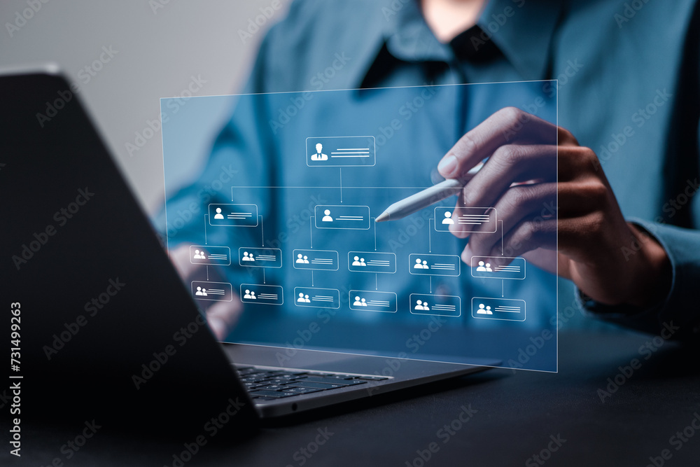 Businessman use laptop with business hierarchy structure for business process and workflow ...