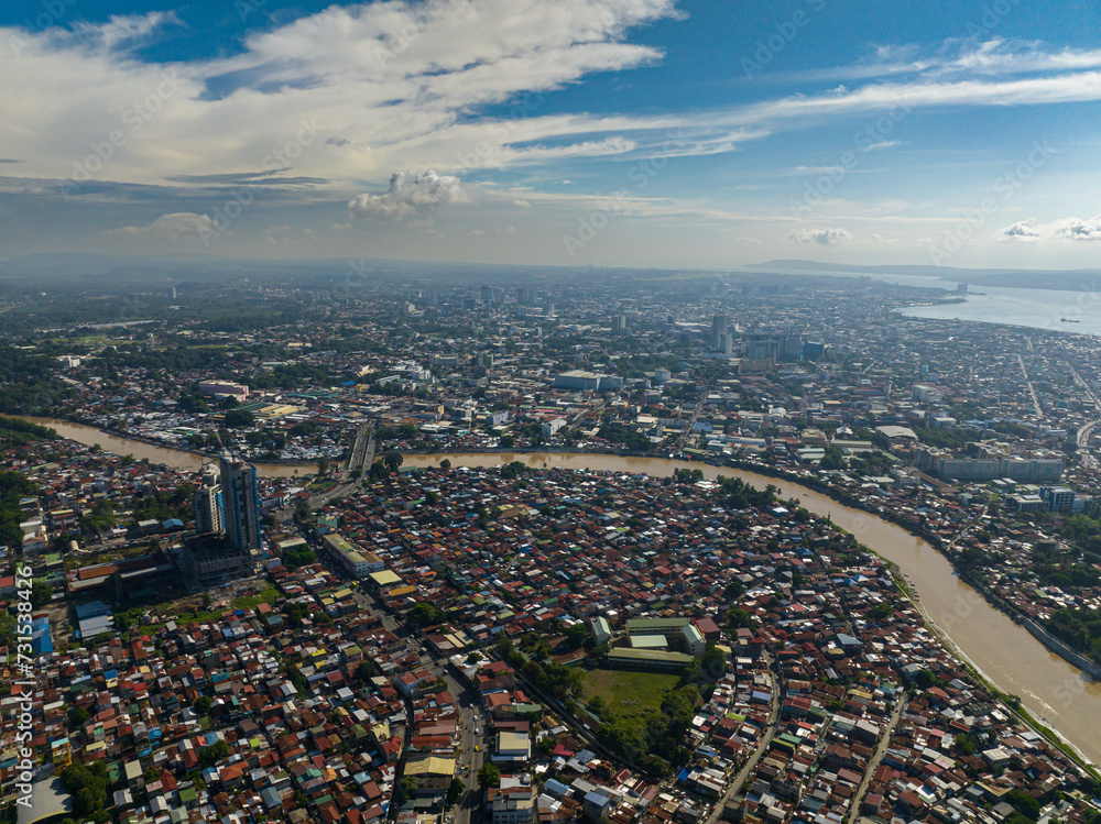 Drone view of residential area in Davao City. Houses in riverside ...