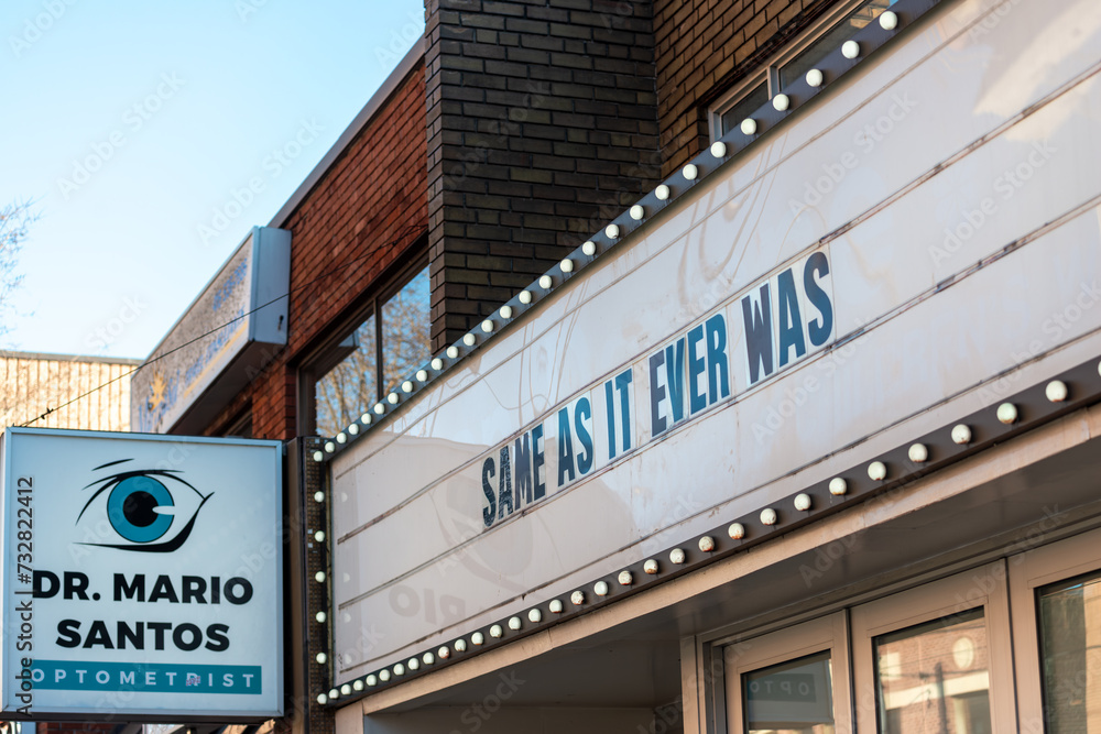 exterior signs of an Optometrist and a marquee sign with message ...
