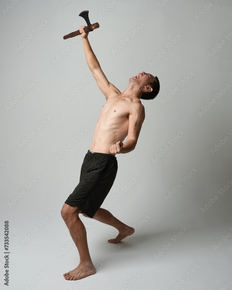 Full length portrait of fit handsome shirtless asian male model ...