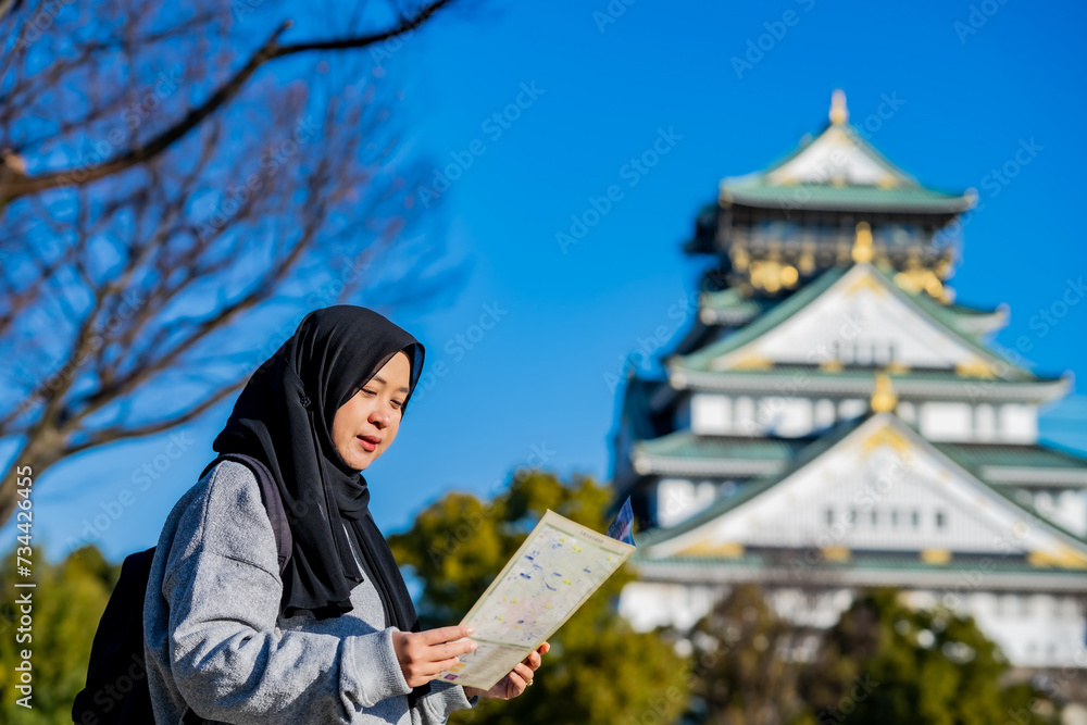 Travel, Muslim travel, Asian Muslim female tourist walking and visitor ...