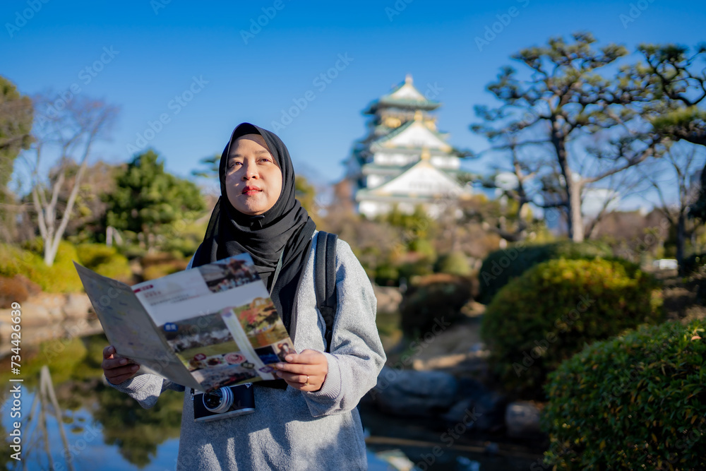 Travel, Muslim travel, Asian Muslim female tourist walking and visitor ...