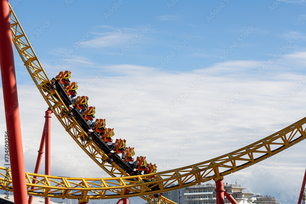 Roller coaster with twists, turns, cave, loops in amusement park Stock ...