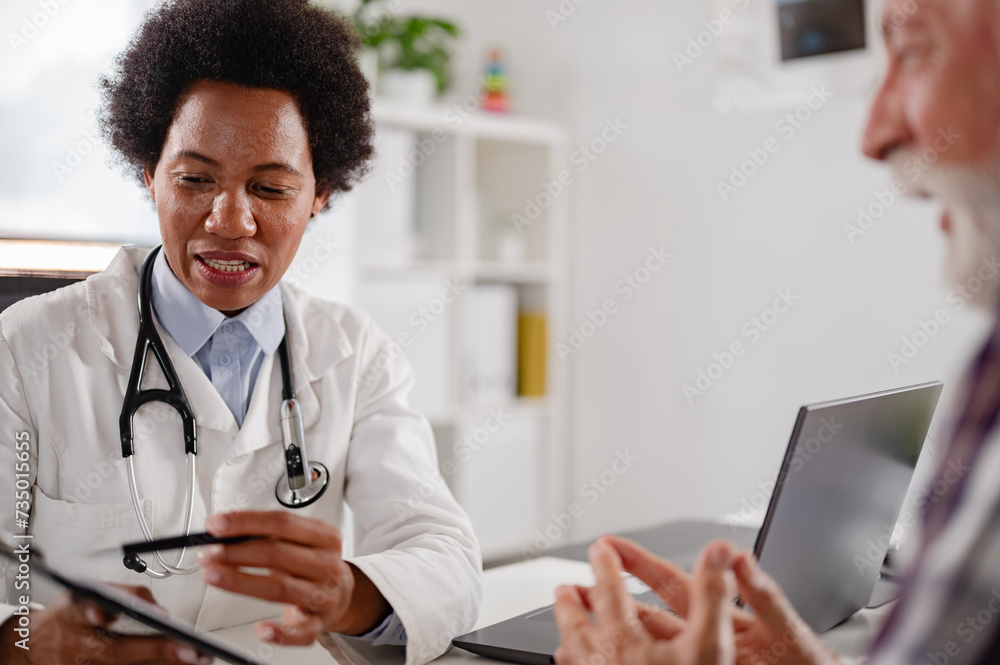 Doctor specialist consulting a patient in a doctor's office at a clinic ...