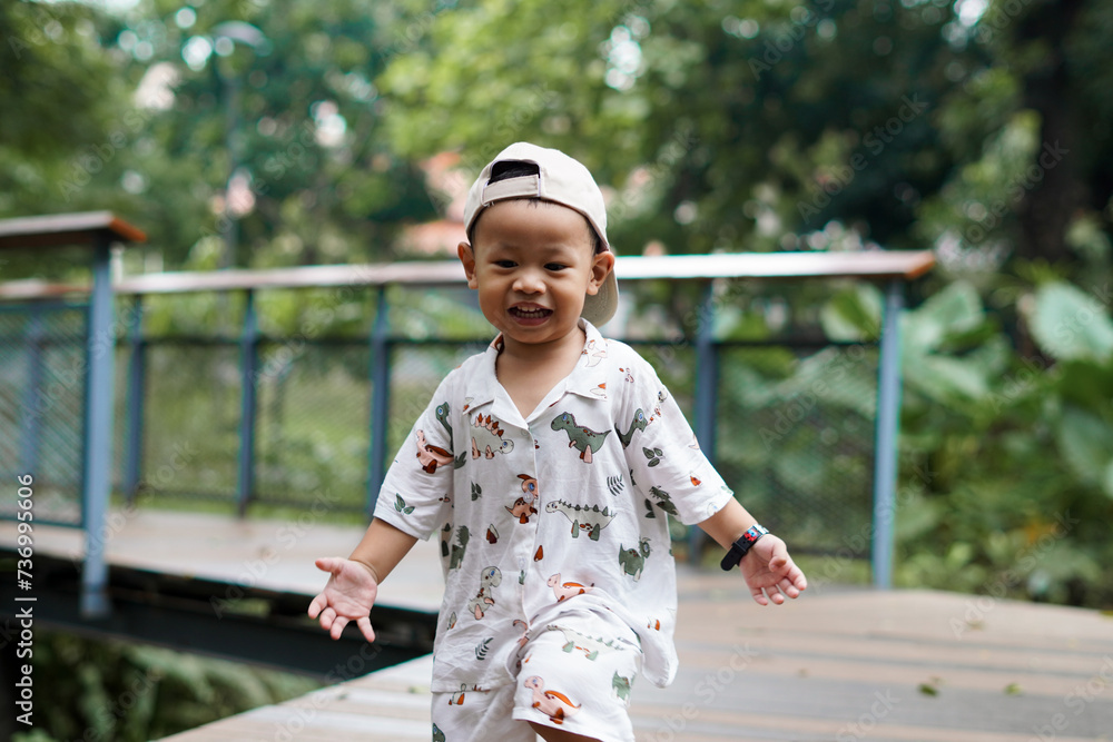 Cheerful Boy Running around and Playing Happily at the Park. Kid ...