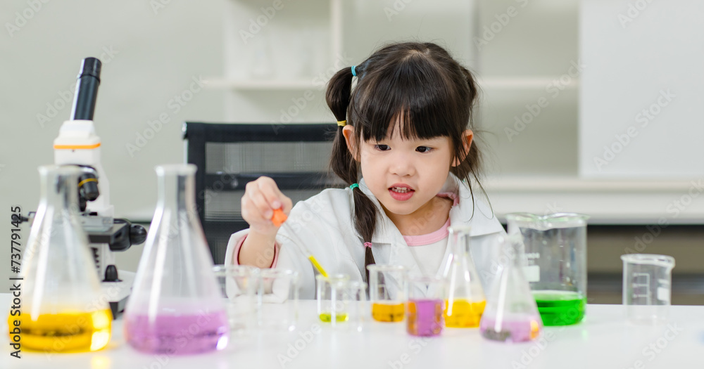Asian little cute girl students in lab coat making test tube science ...