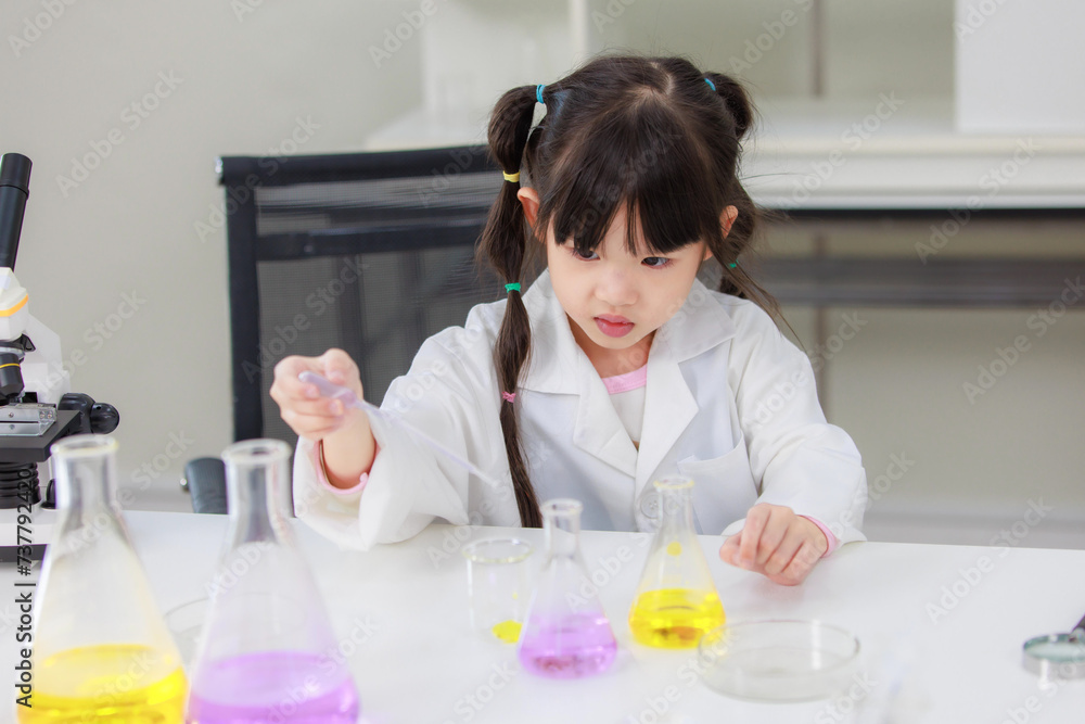 Asian little cute girl students in lab coat making test tube science ...